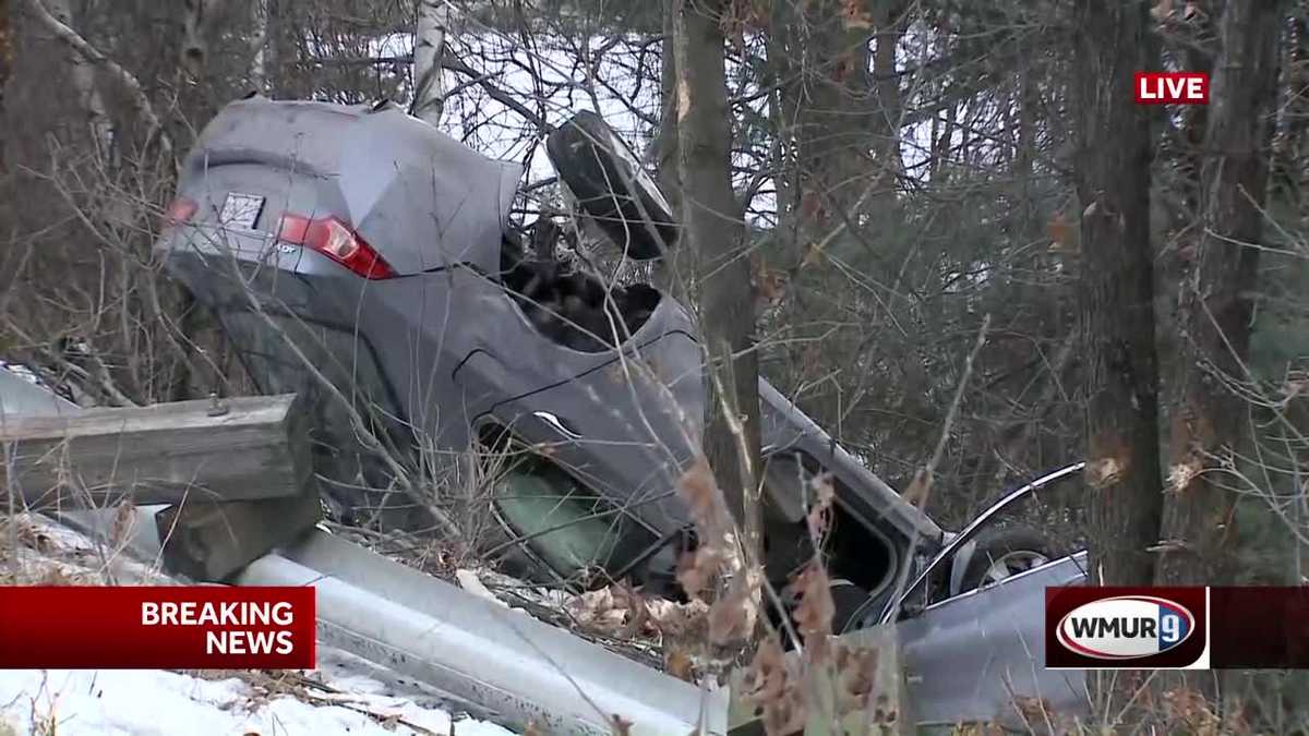 Car crashes over guardrail, down embankment