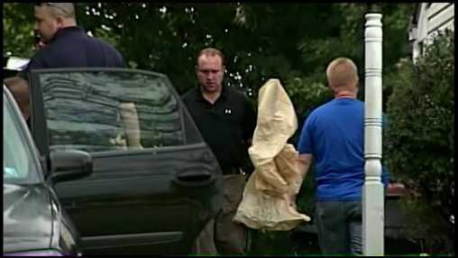 Police seize items from suspect's home