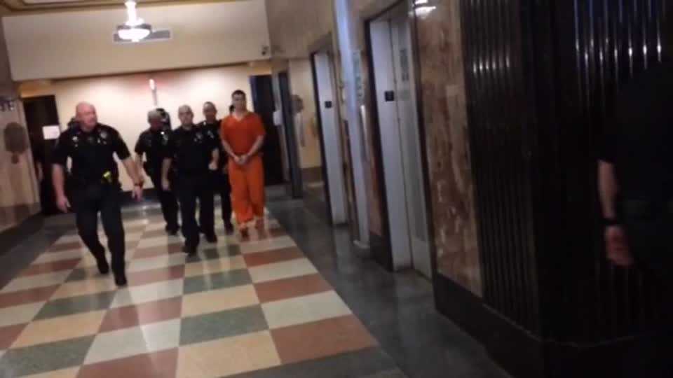 Fired Oklahoma City police officer walks into court for sentencing hearing