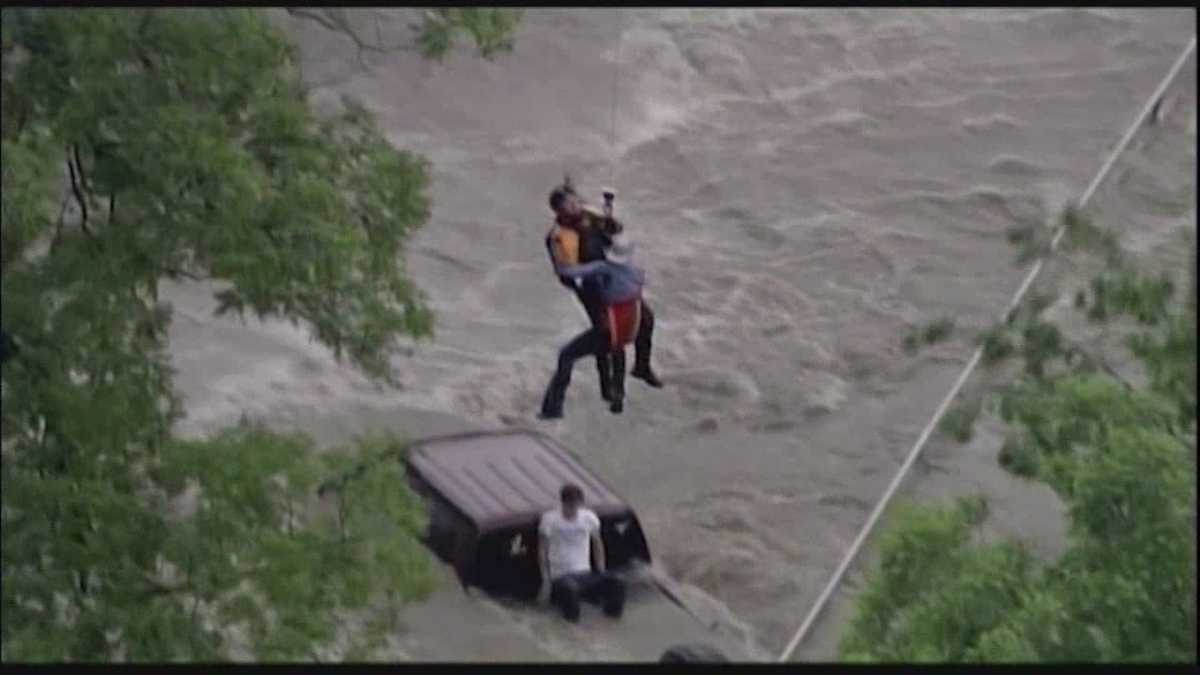 2 rescued from raging flood waters
