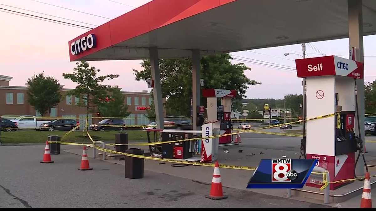 Two people injured after truck hits gas pump