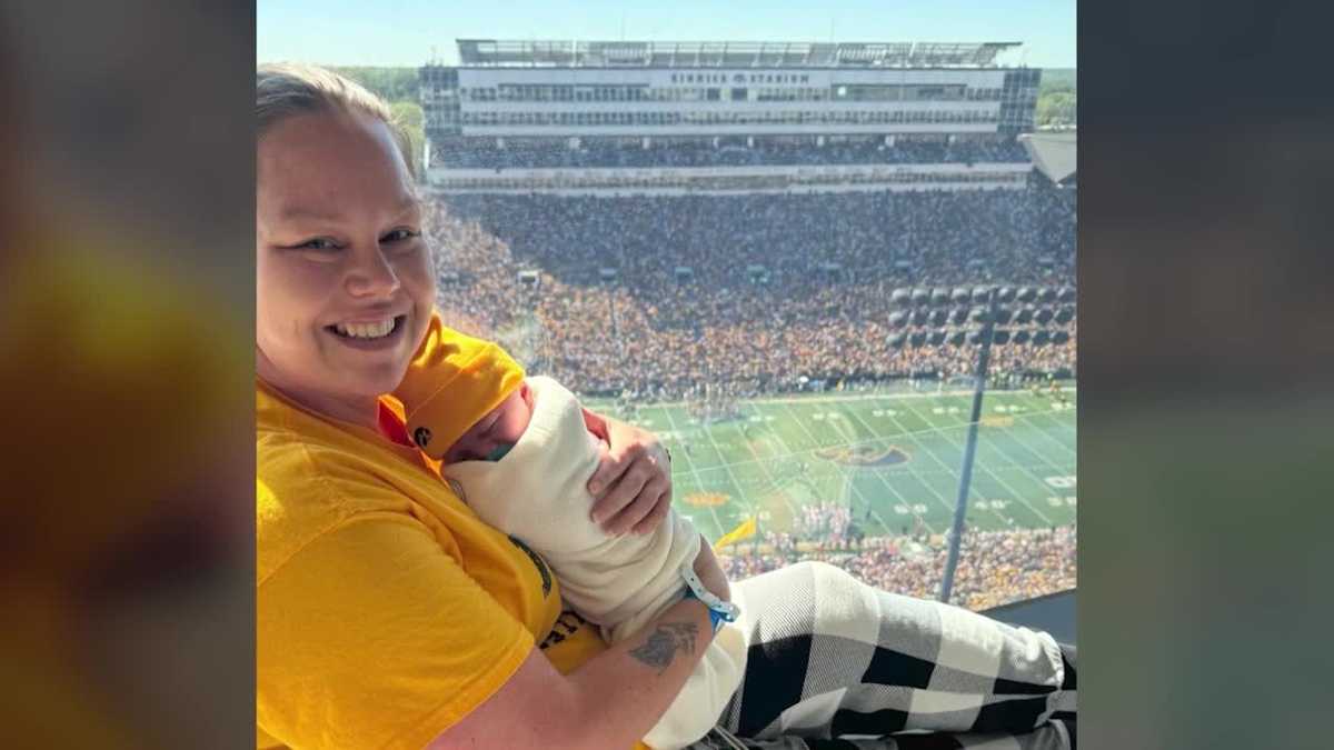 Hawkeye Wave: Des Moines mother, infant daughter wave back to fans at ...