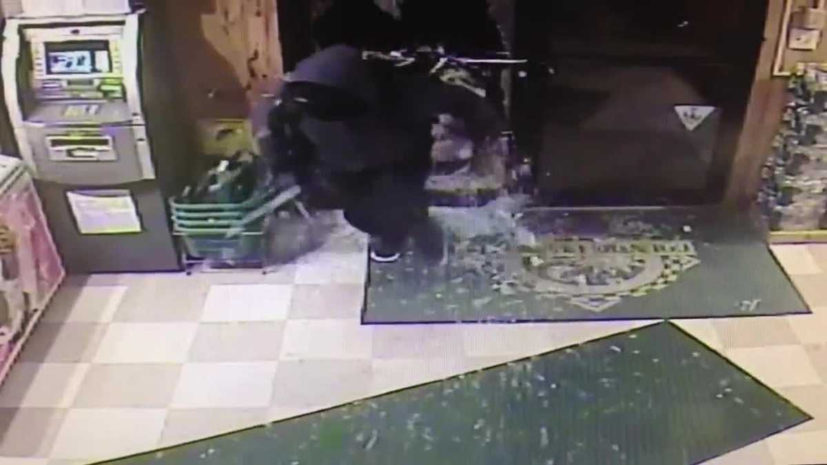 Video shows masked men smashing through front door of store