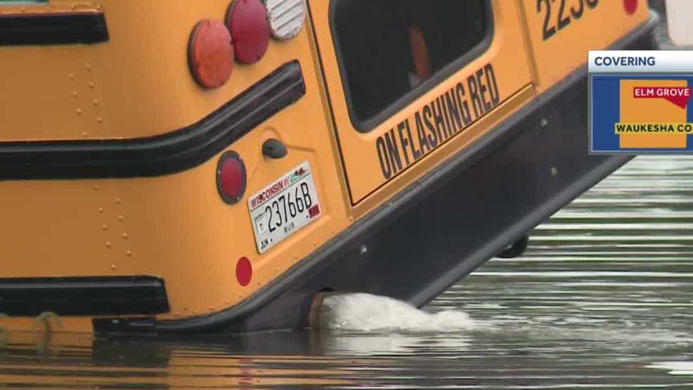School bus stuck in flooded street in Elm Grove