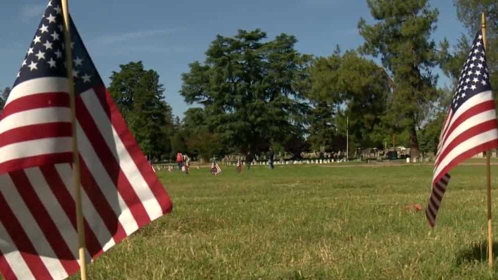 Volunteers place dozens of flags in Sacramento cemetery for Memorial Day
