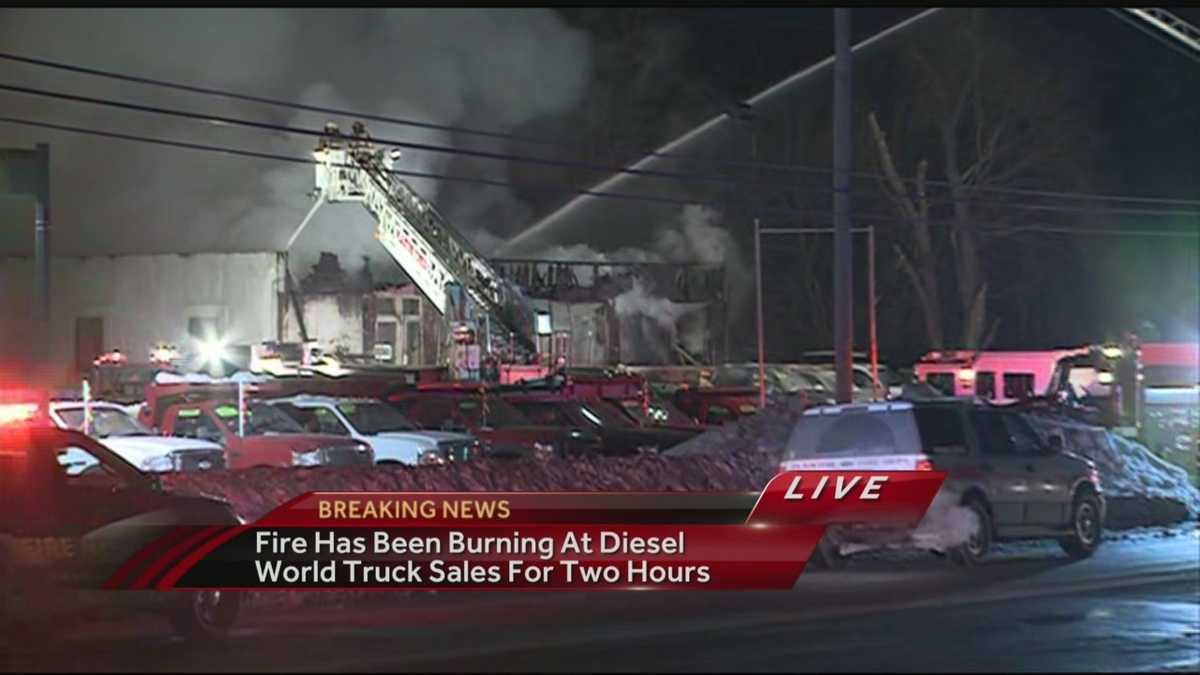 Crews fight fire at used truck dealership