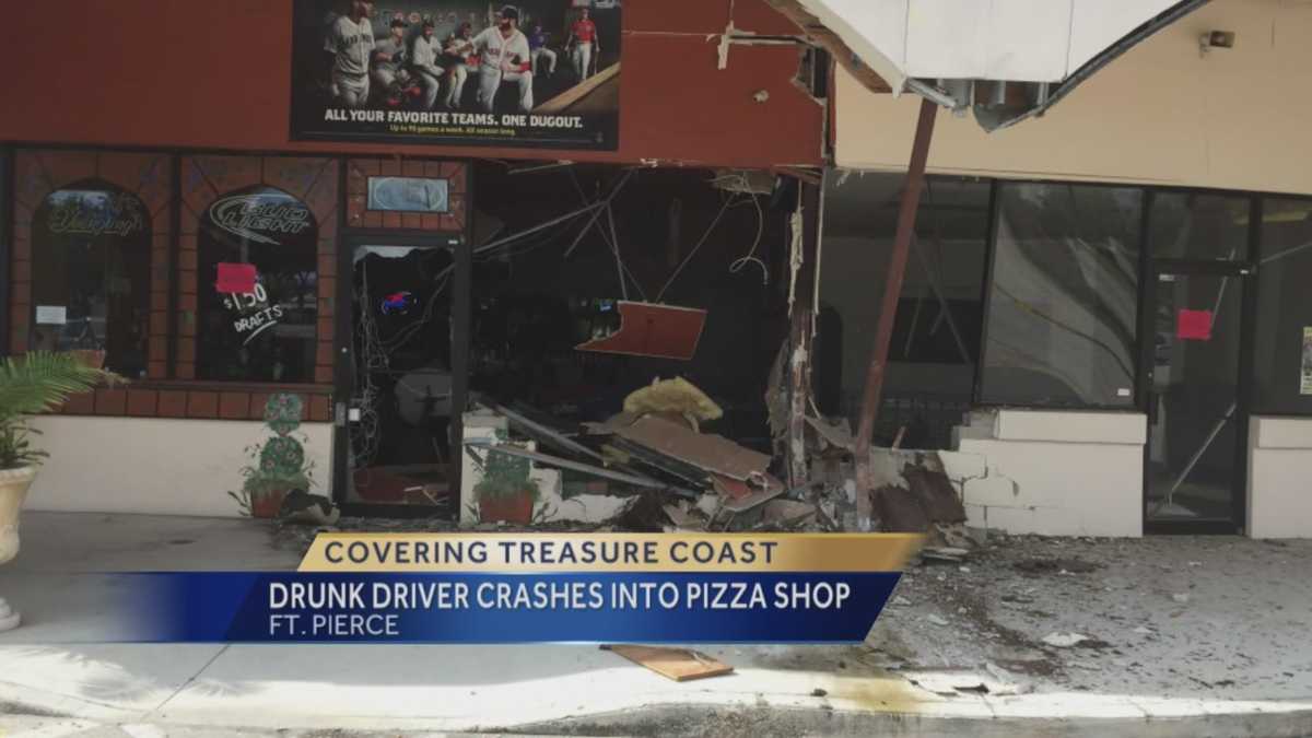SUV crashes into pizza shop