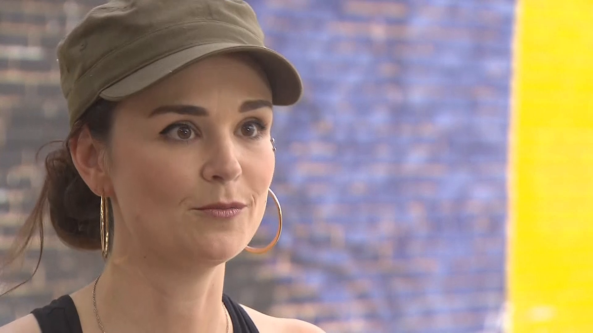 Woman with prosthetic leg turned away from handicap dressing room