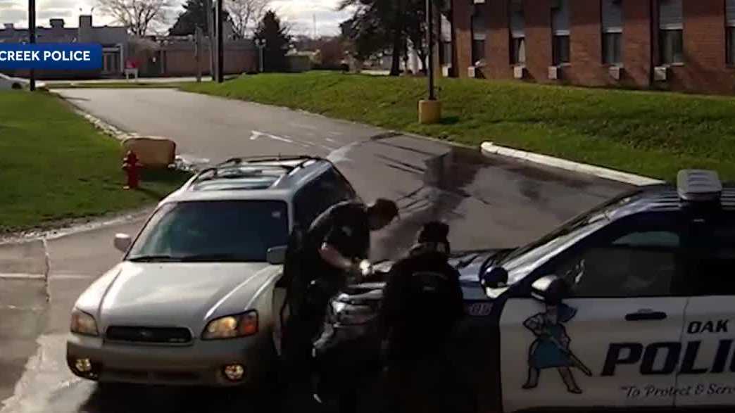 Video: Driver hits Oak Creek police officer outside Red Roof Inn