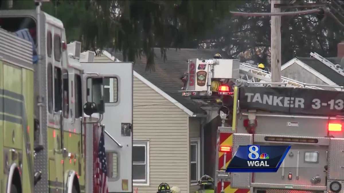 Soot-covered man rescued from burning home