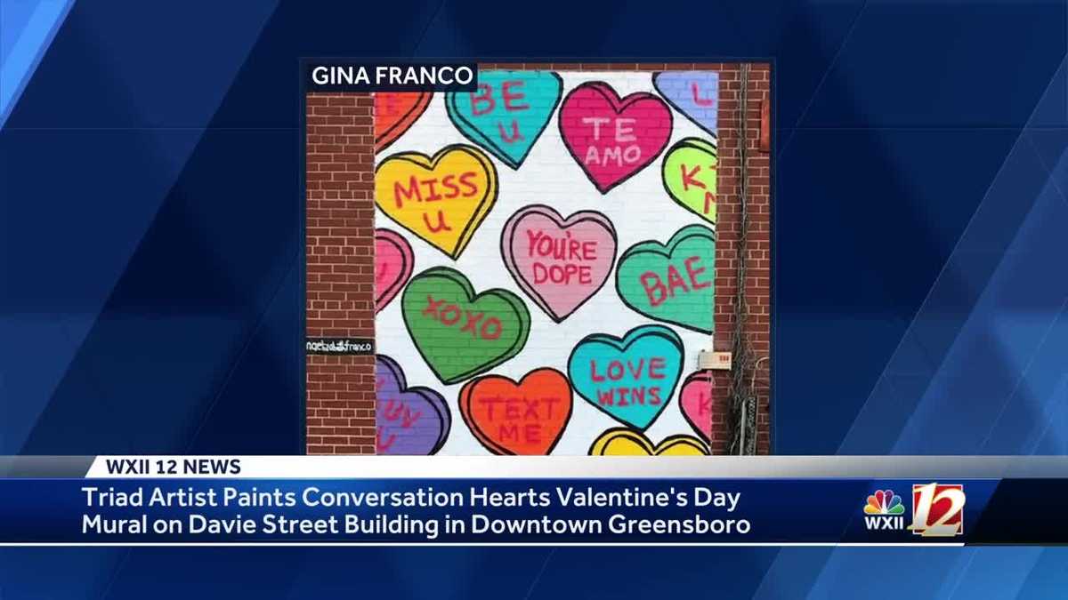 Conversation hearts: Triad artist paints Valentine's Day mural in ...