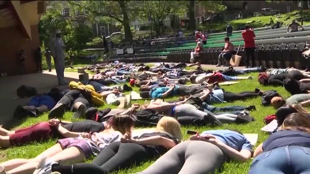 Protesters march through Greensburg, lie on their stomachs in solidarity