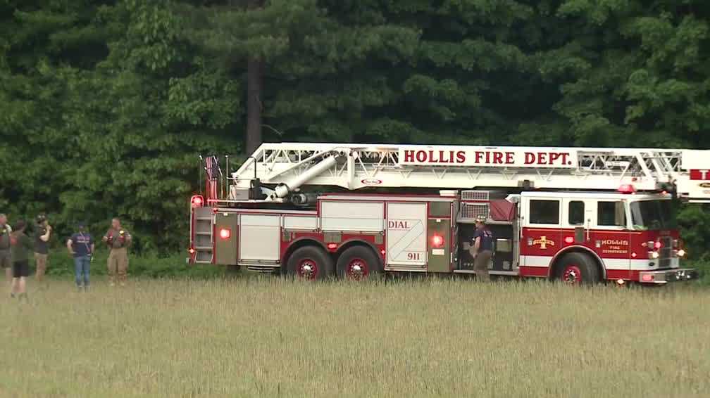 Fire officials help bring down person stuck in tree with parachute on ...