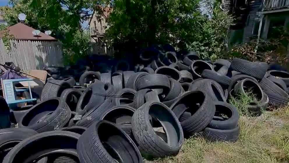 Dozens of tires pile up at illegal dumping site