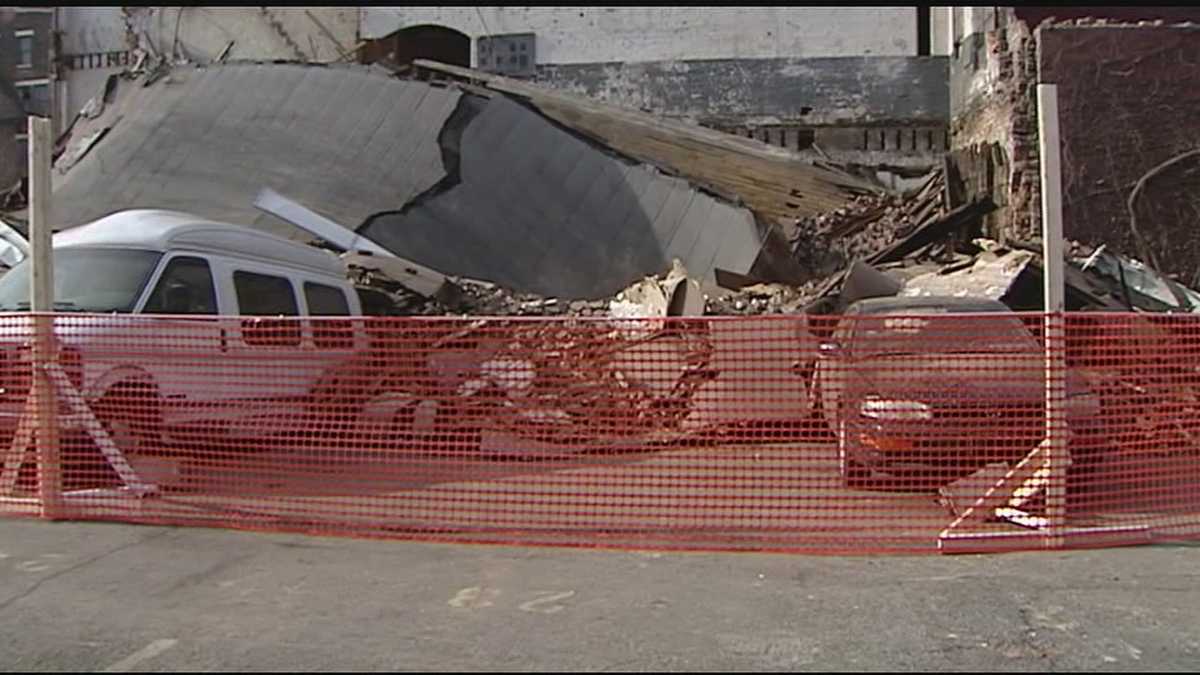 Crews work to clear debris after building collapses downtown