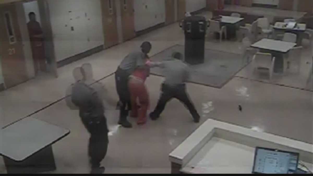 Video shows man throwing punches at guards Video shows man throwing punches at guards