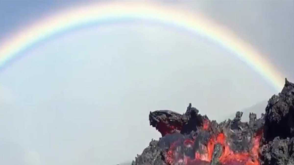 Rainbow Forms Over Flowing Lava