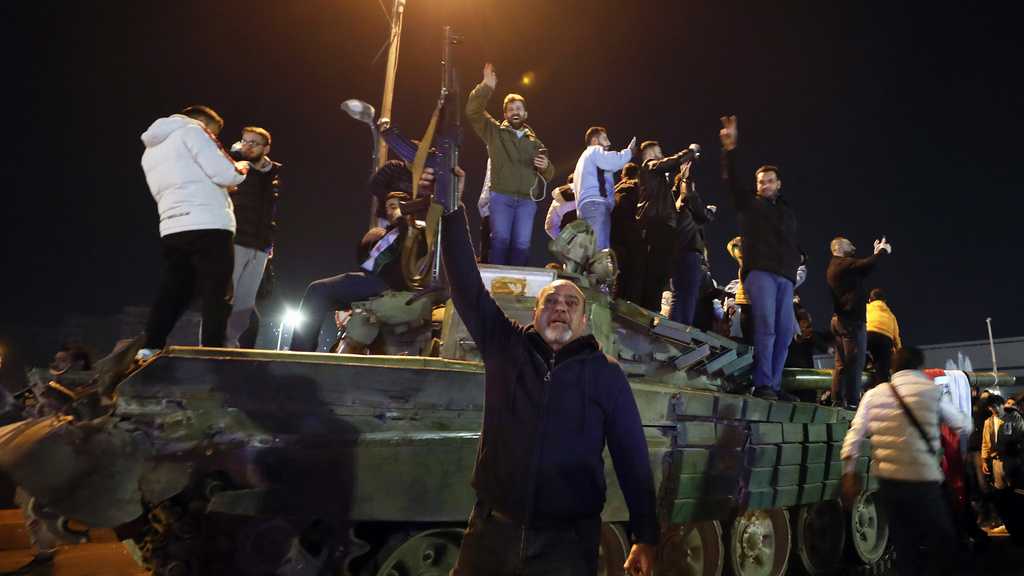 Syria latest: Syrians celebrate Bashar Assad's fall as his whereabouts ...