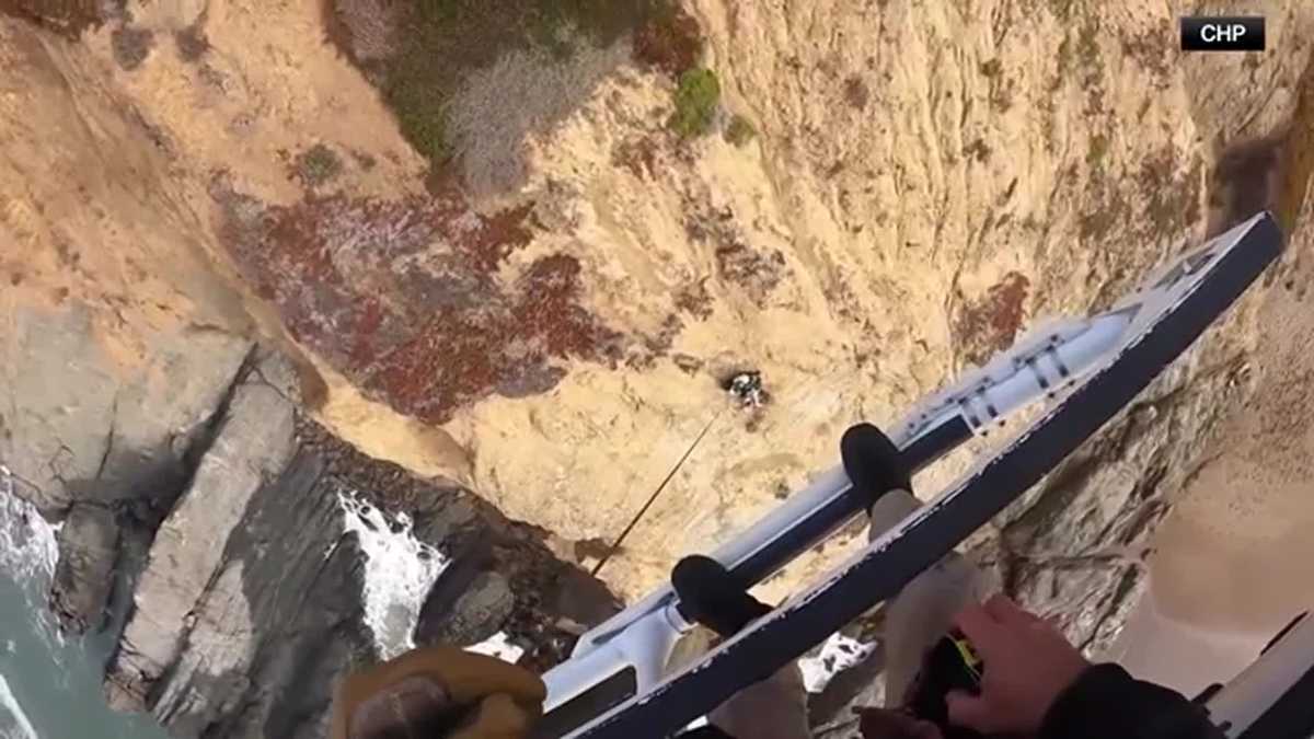 VIDEO: Man dangling from cliff rescued by helicopter crew