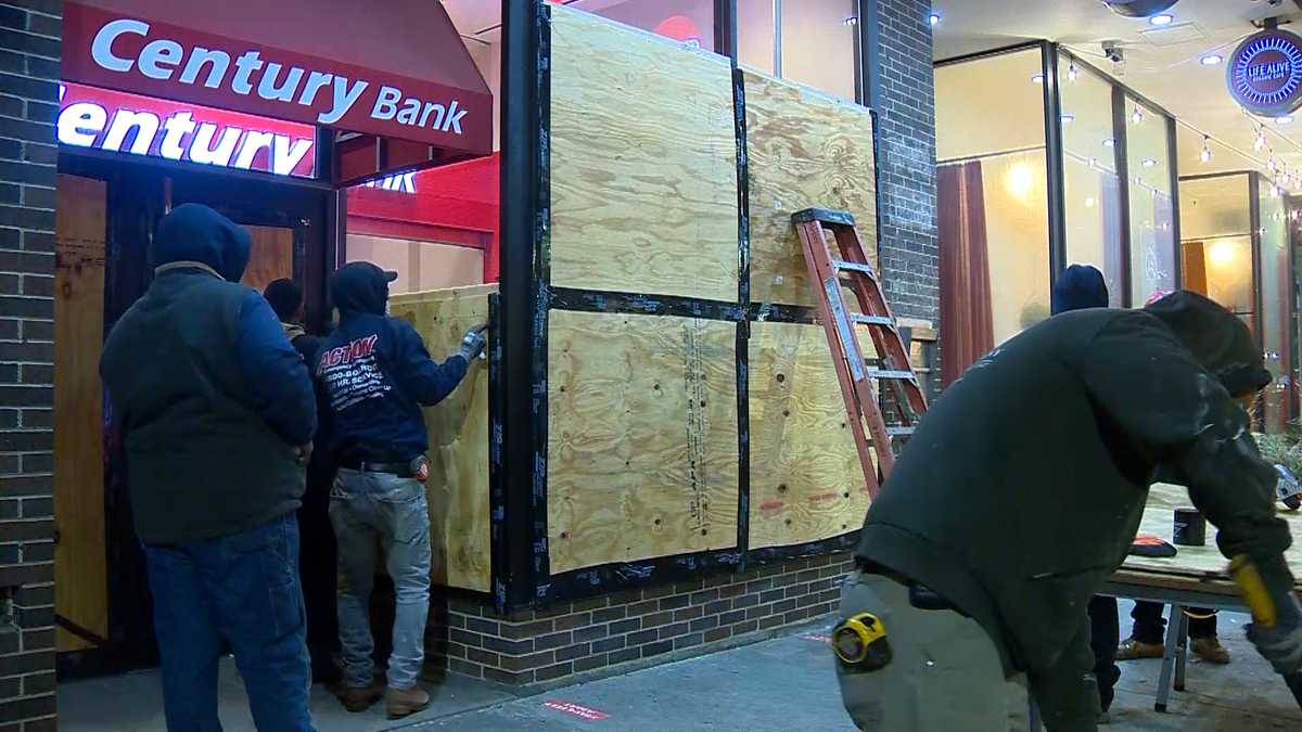 Crews boarding up businesses in Boston; National Guard on standby