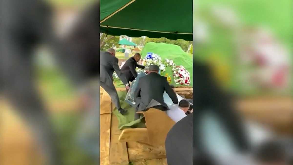 Shocking video shows pallbearers and casket falling into grave in ...