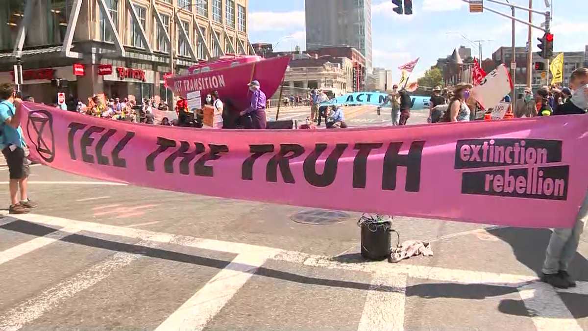 Climate activists block Mass Pike ramp with pink boat as part of protest