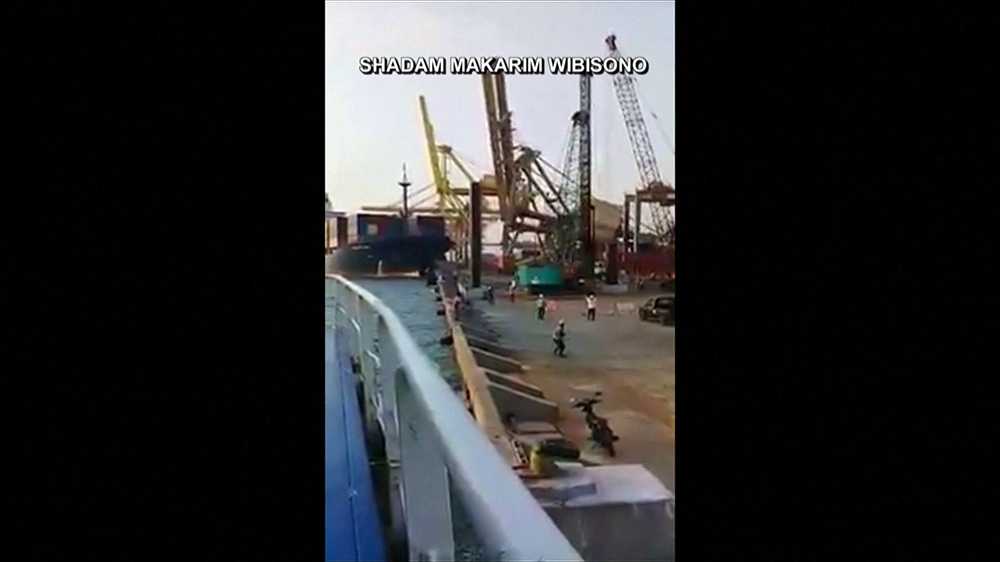 Video: Huge container ship crashes into crane, knocking it over