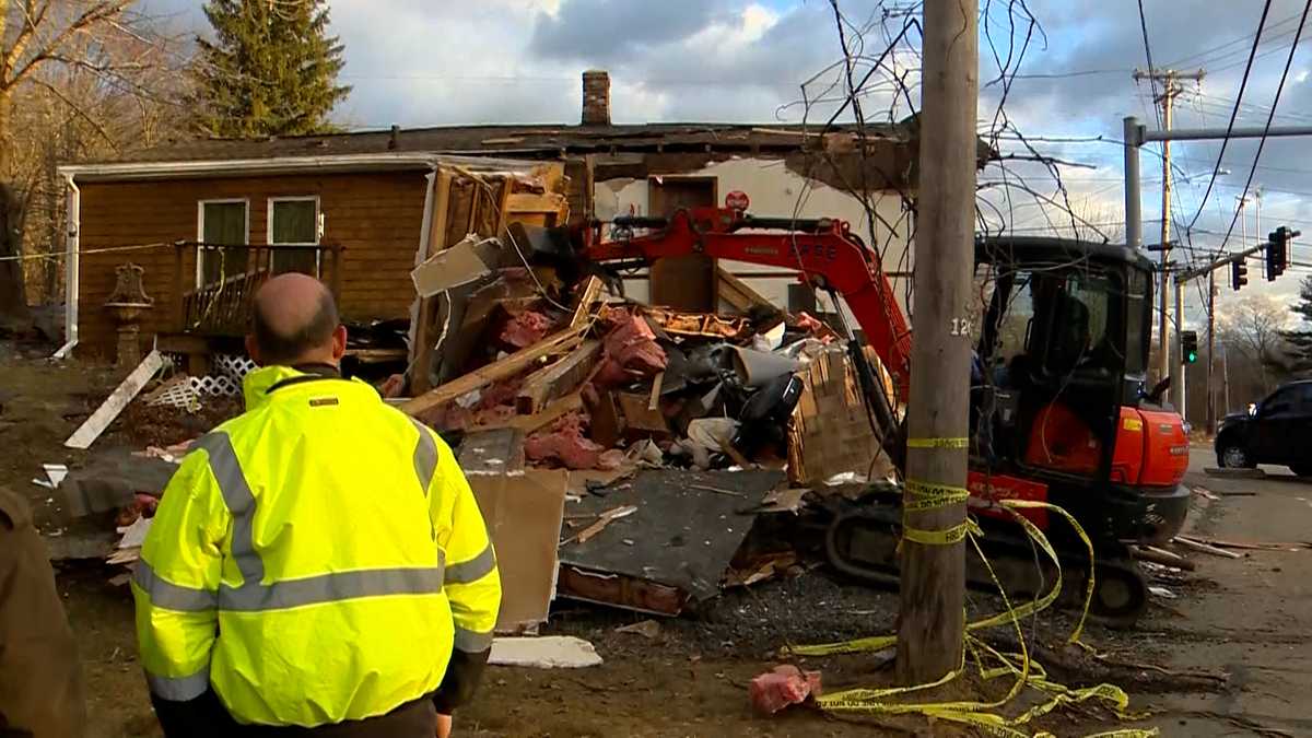 Part of Mass. home torn down after car slams into porch