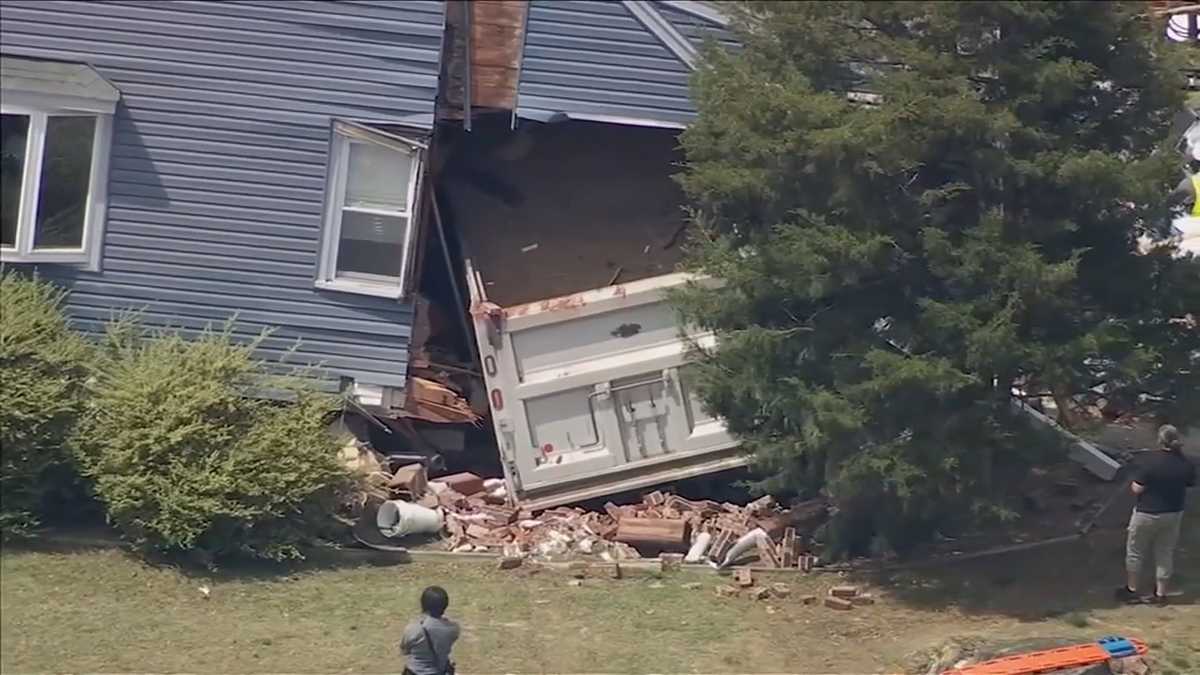 Dashcam video shows shocking moment dump truck smashes into home