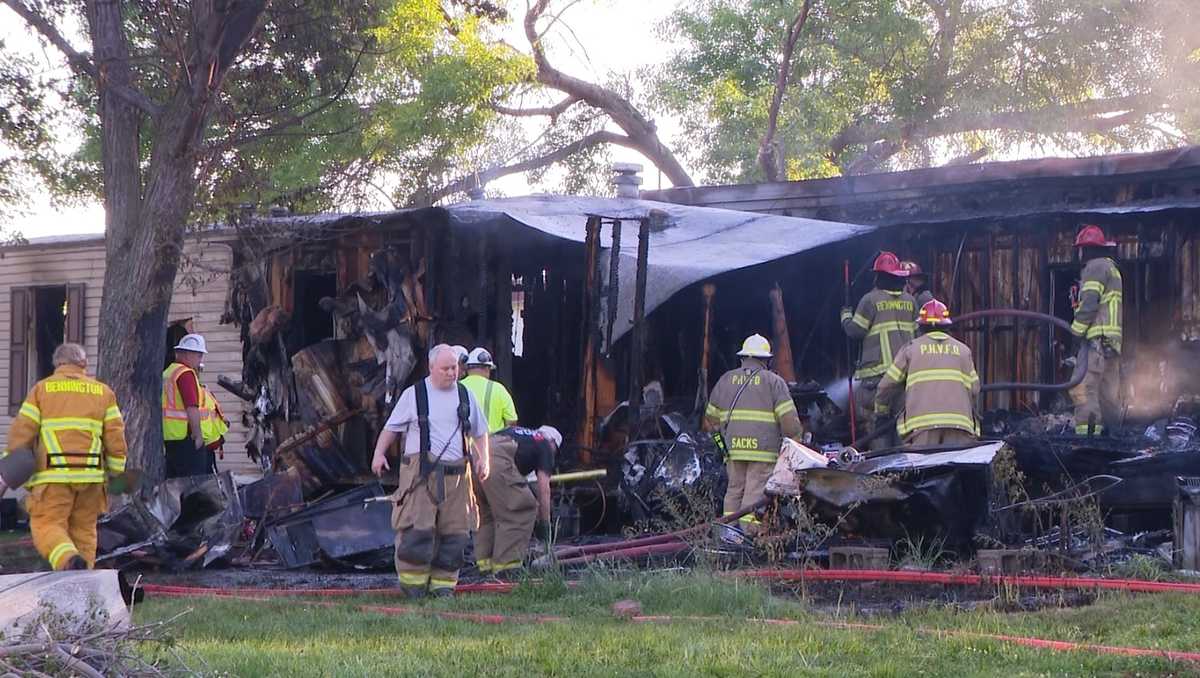 Multiple people inside as flames engulf trailer home