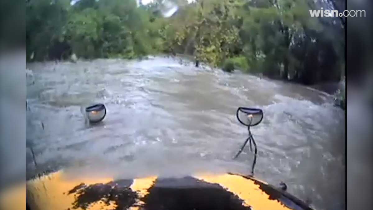 Video shows school bus swept away in floodwater