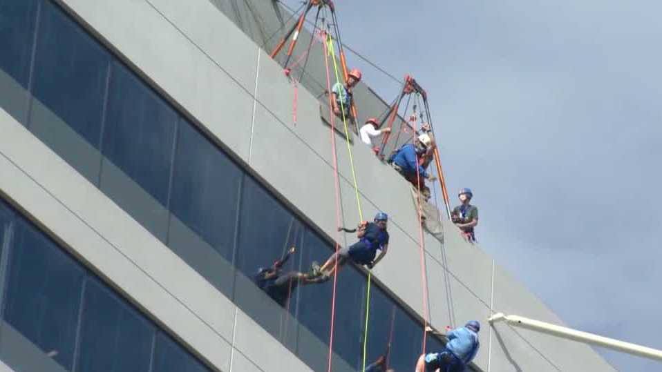 Jennifer supports Special Olympics ... by rappelling down building