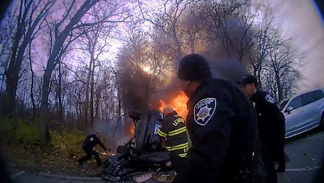 Bodycam Video Shows Police In Kansas Pulling Woman From Burning Vehicle
