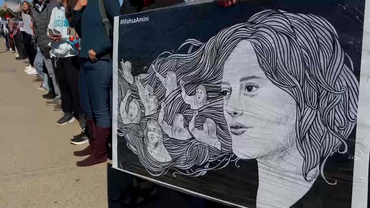 Dozens gather on Harvard Bridge to protest death of Mahsa Amini