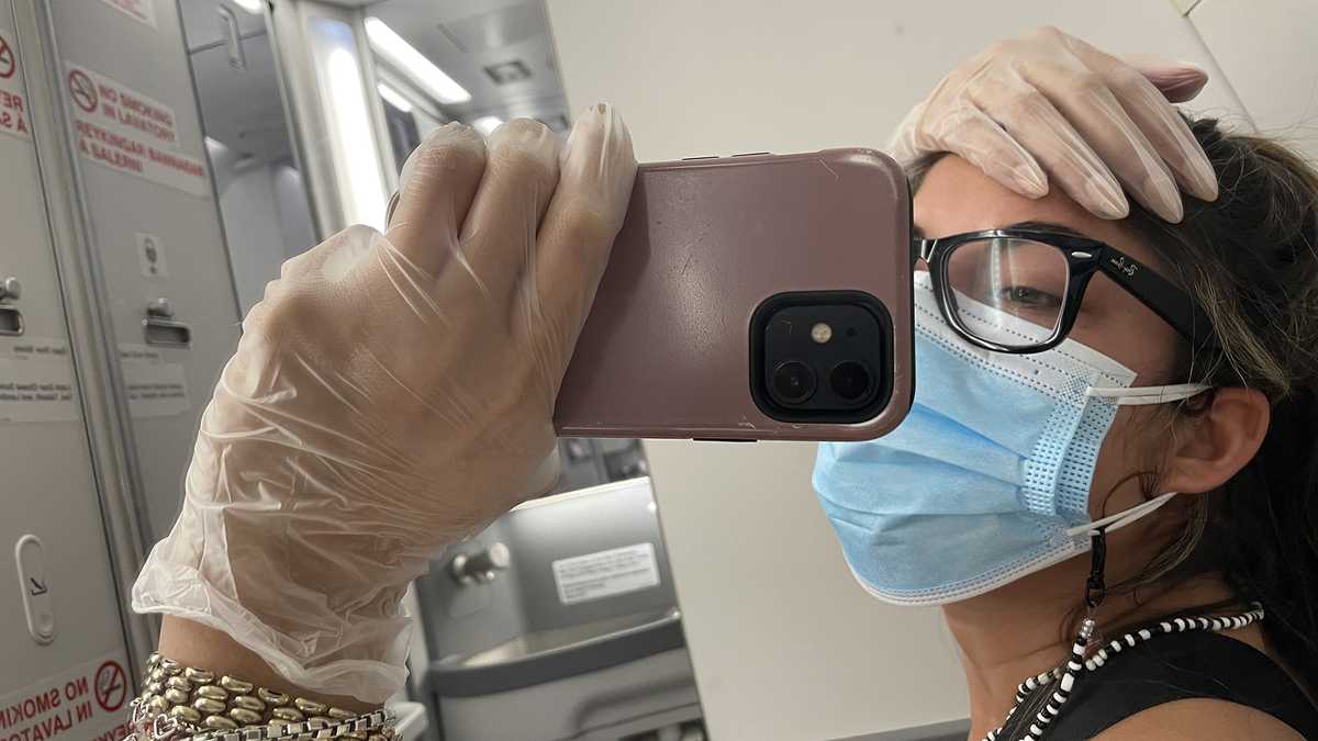 Woman quarantined in airplane bathroom for 3 hours after testing ...