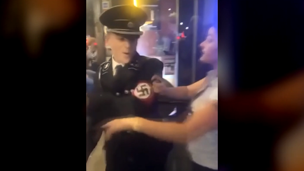 Video shows Georgia man in Nazi uniform hitting woman outside bar