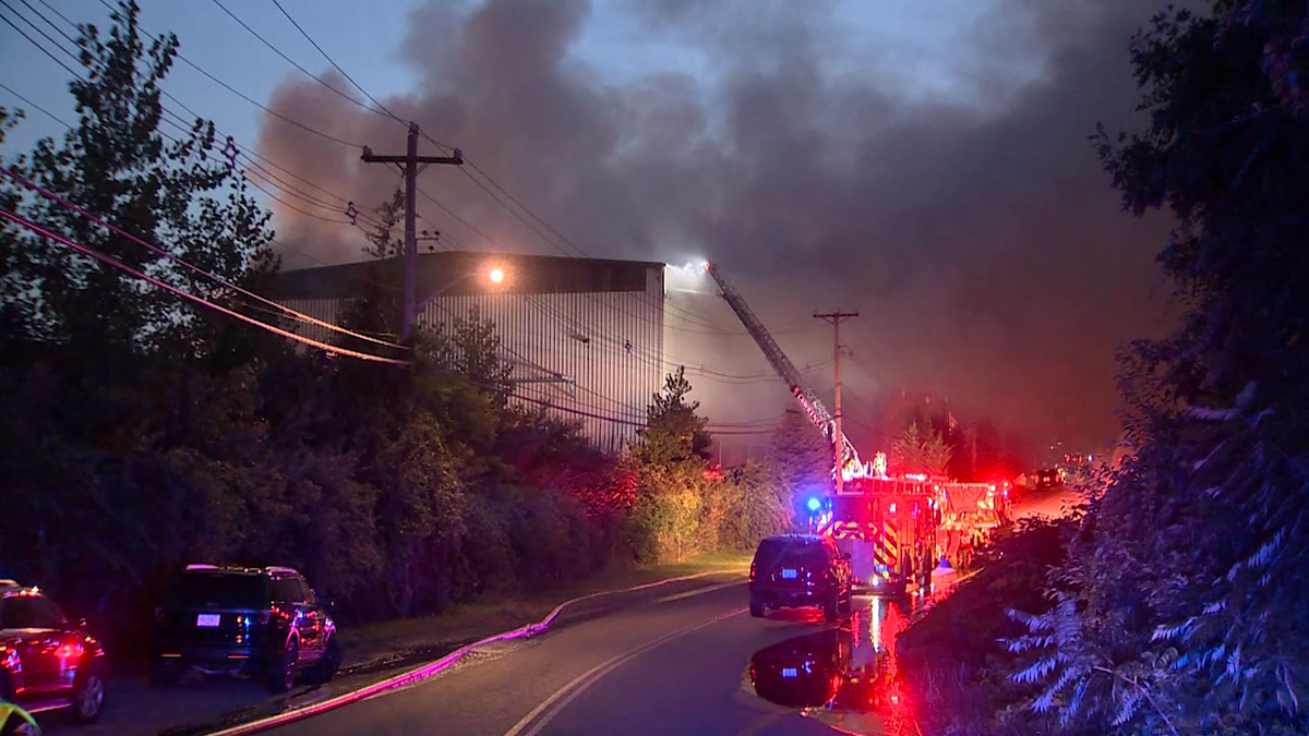 Firefighters expect to battle massive 4-alarm fire through AM