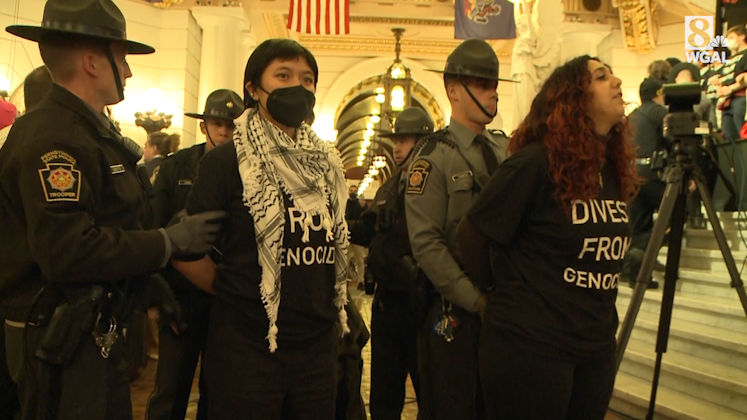 Troopers handcuff some protesters who entered Pa. Capitol