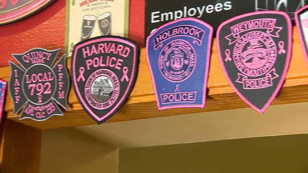 Weymouth cafe collects pink police patches to raise breast cancer awareness