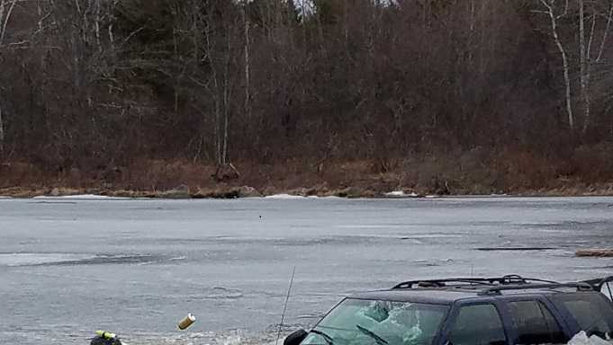 SUV goes through ice, gets submerged in lake