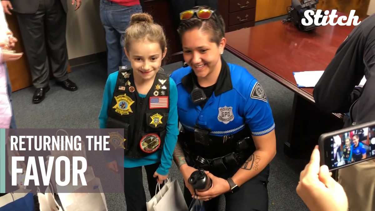 Little girl shows her appreciation to police officers with goodie bags