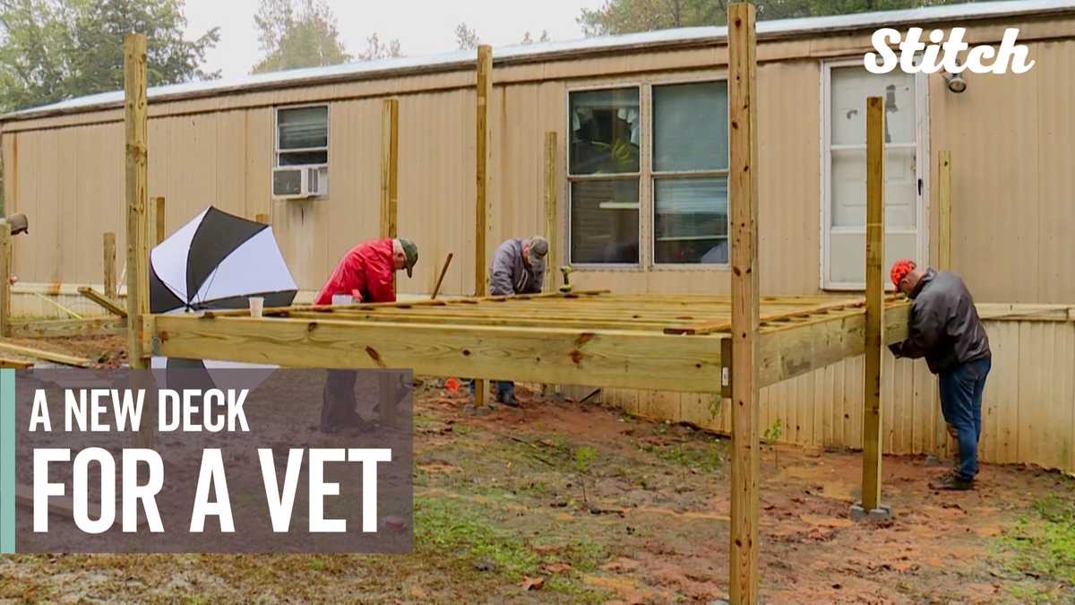 Volunteers pitch in to build new deck for Navy veteran
