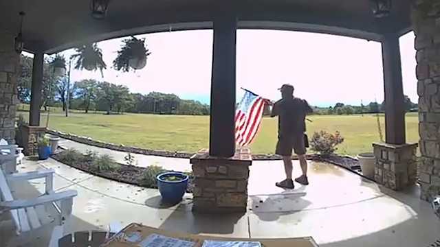 WATCH: Delivery driver fixes American flag rolled up in wind at ...