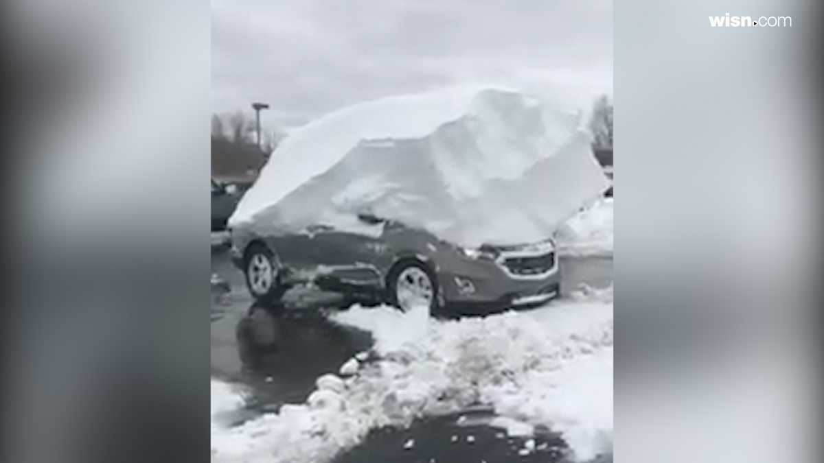 Digging out: Car dealership crew moves cars buried under snow
