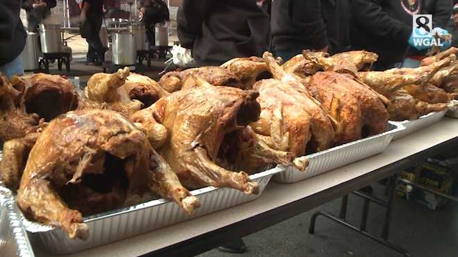 100 turkeys deep-fried on York street for free Thanksgiving meal